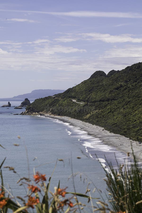 Dramatic Coastal Landscape with Rugged Cliffs and Pristine Beach on a ...