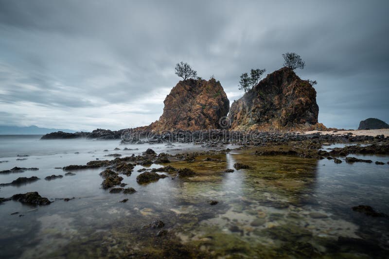 Dramatic Coastal Scene of Diguisit, Aurora Featuring Two Rugged Rock ...