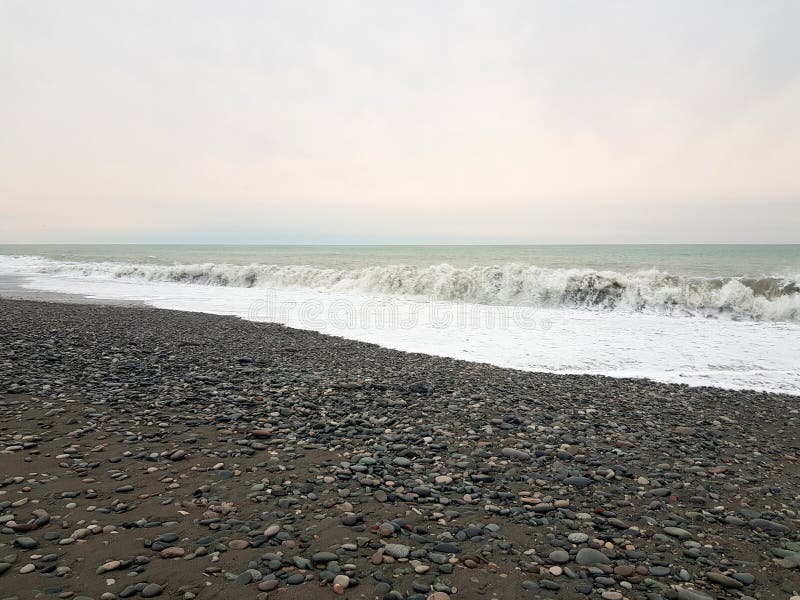 Dramatic Cold Ocean Background with Sea Wave and Beach with Black Sand ...