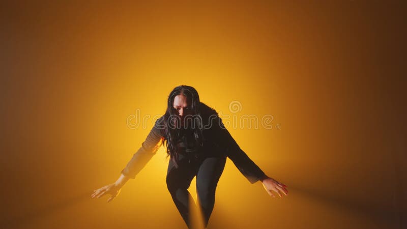 Dramatic Crouching Pose Against Yellow Background Stock Video - Video ...