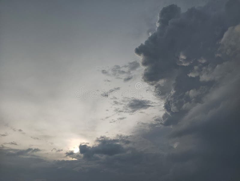 Dramatic Dark Cloud with Sun Shining Behind after Rain Fall in the ...