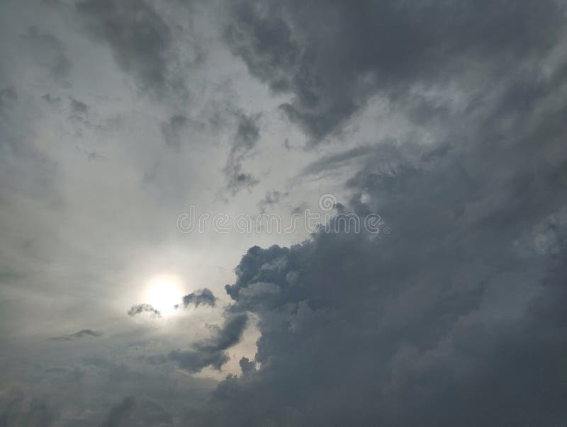 Dramatic Dark Cloud with Sun Shining Behind after Rain Fall in the ...