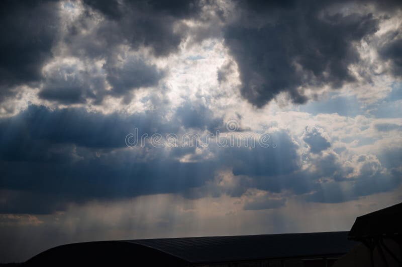 Dramatic Dark Clouds with Penetrating Rays of Light. Stock Image ...