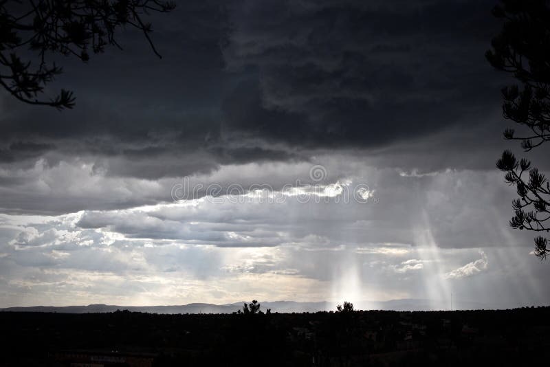 Dramatic Dark Photo of Sun Rays Breaking through the Clouds Stock Photo ...