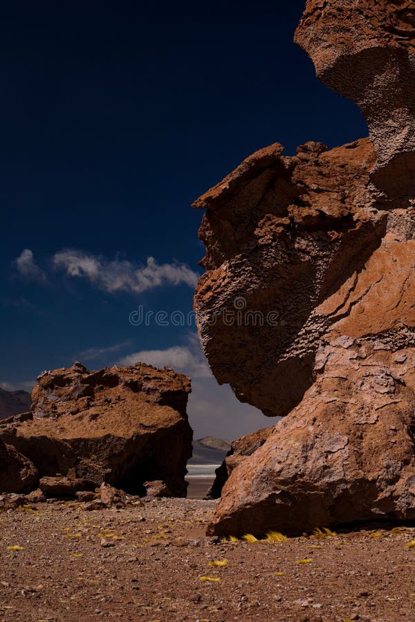 Dramatic Desert Rock Formations Under a Blue Sky. Stock Image - Image ...
