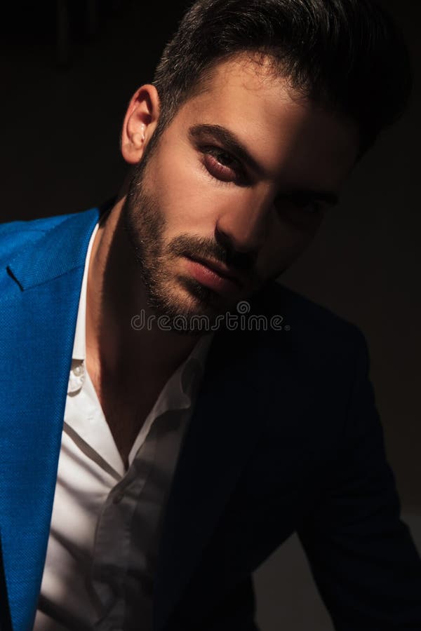Dramatic Elegant Young Man with Ray of Light on Face Stock Image ...