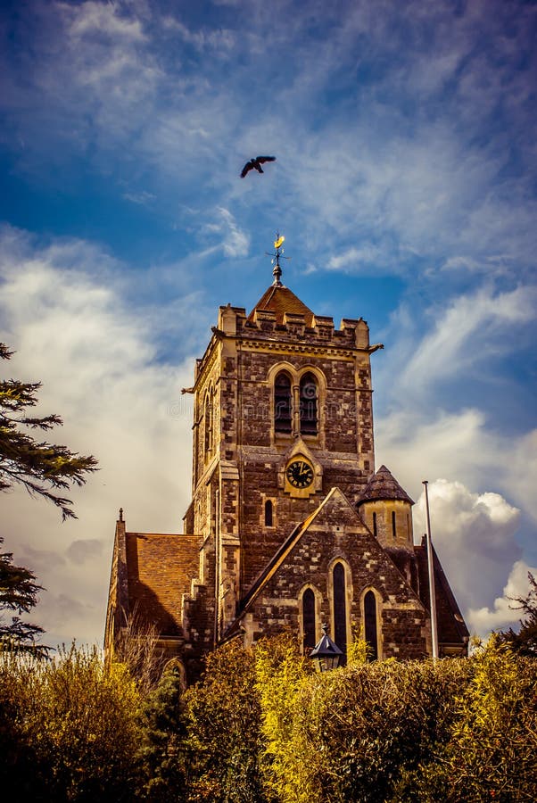 Dramatic English Church Against Blue Sky Stock Photo - Image of roof ...