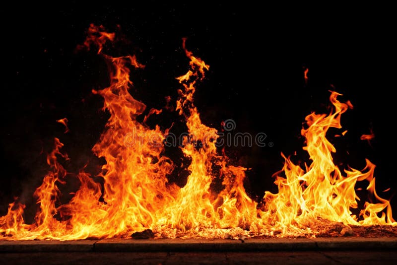Dramatic Fire Flames Against a Black Background Stock Illustration ...