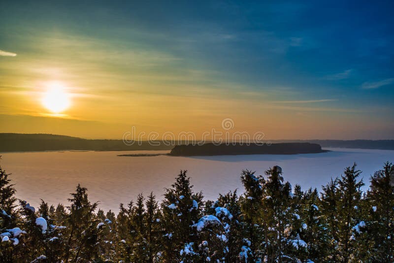 Dramatic High Contrast Clouds in Sunset Over Frozen Lake Stock Image ...