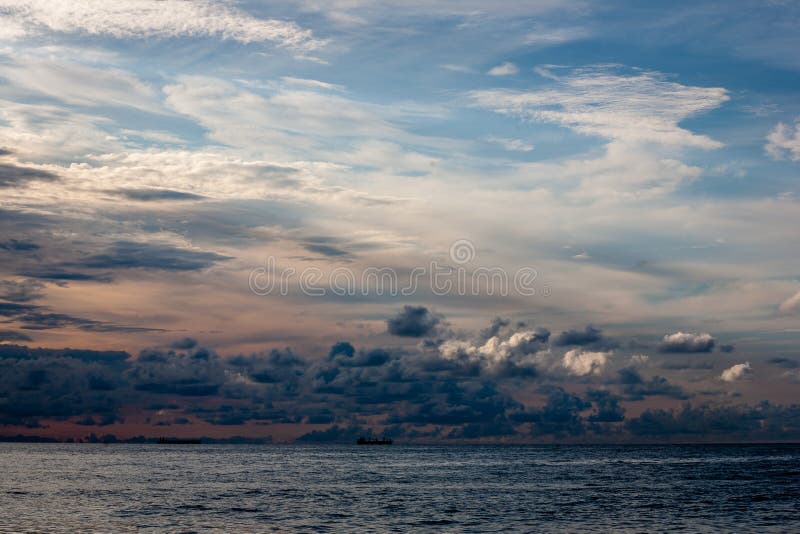 Dramatic High Contrast Clouds in Sunset Over Seaside Beach Stock Image ...