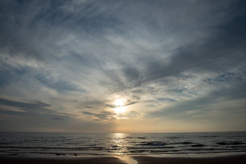 Dramatic High Contrast Clouds in Sunset Over Seaside Beach Stock Image ...