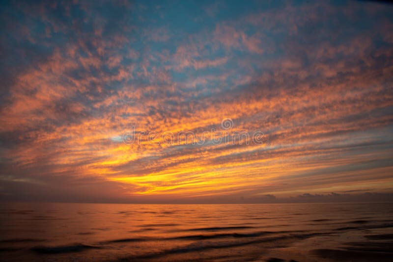 Dramatic High Contrast Clouds in Sunset Over Seaside Beach Stock Photo ...