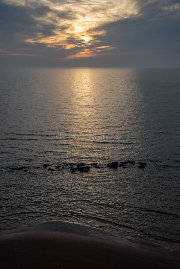 Dramatic High Contrast Clouds in Sunset Over Seaside Beach Stock Photo ...