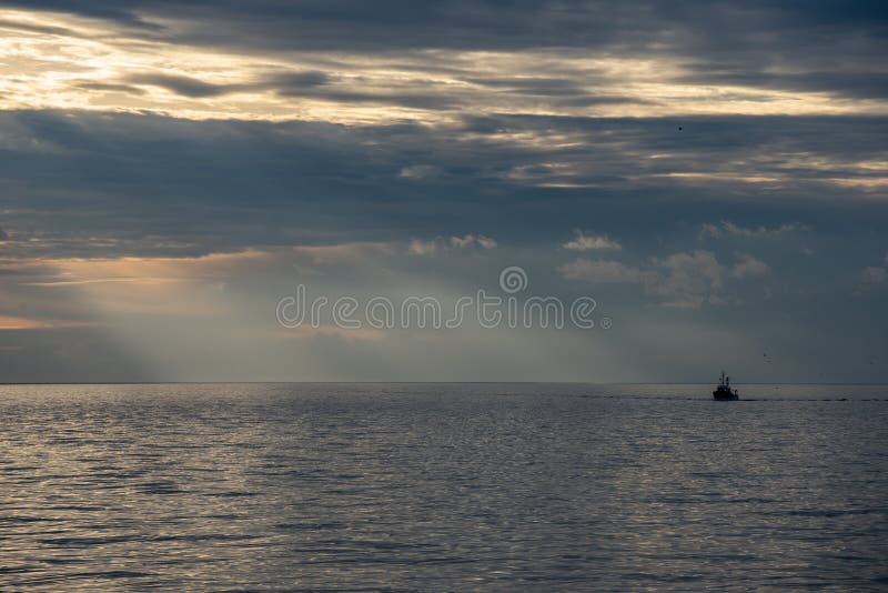 Dramatic High Contrast Clouds in Sunset Over Seaside Beach Stock Photo ...