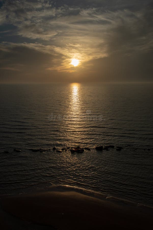 Dramatic High Contrast Clouds in Sunset Over Seaside Beach Stock Photo ...