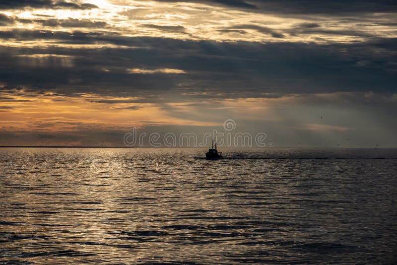 Dramatic High Contrast Clouds in Sunset Over Seaside Beach Stock Image ...