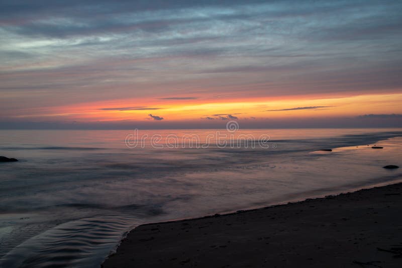 Dramatic High Contrast Clouds in Sunset Over Seaside Beach Stock Image ...