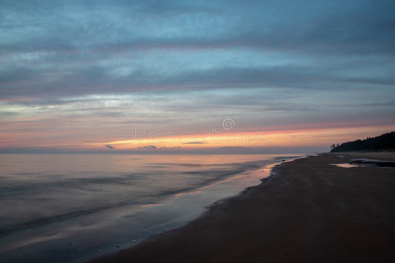 Dramatic High Contrast Clouds in Sunset Over Seaside Beach Stock Image ...