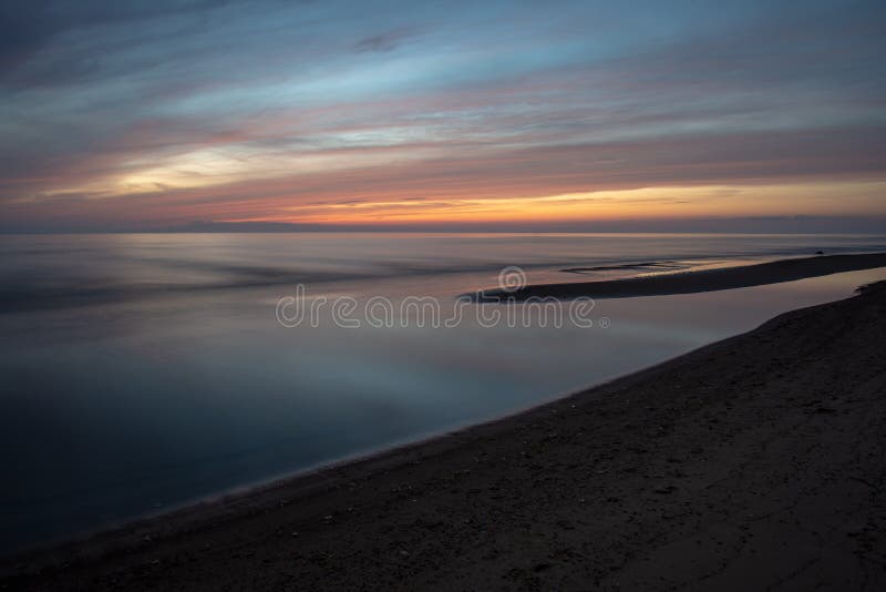 Dramatic High Contrast Clouds in Sunset Over Seaside Beach Stock Image ...