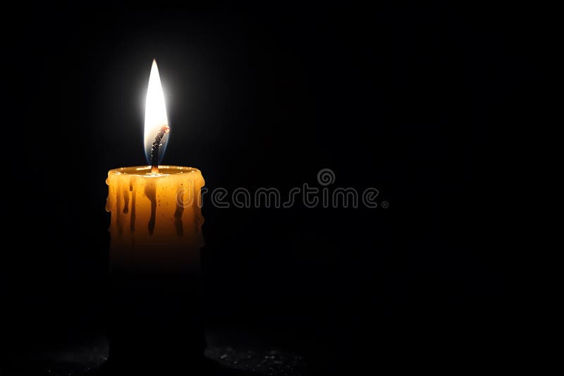 A Dramatic, High-contrast Image of a Solitary Candle Flickering in the ...