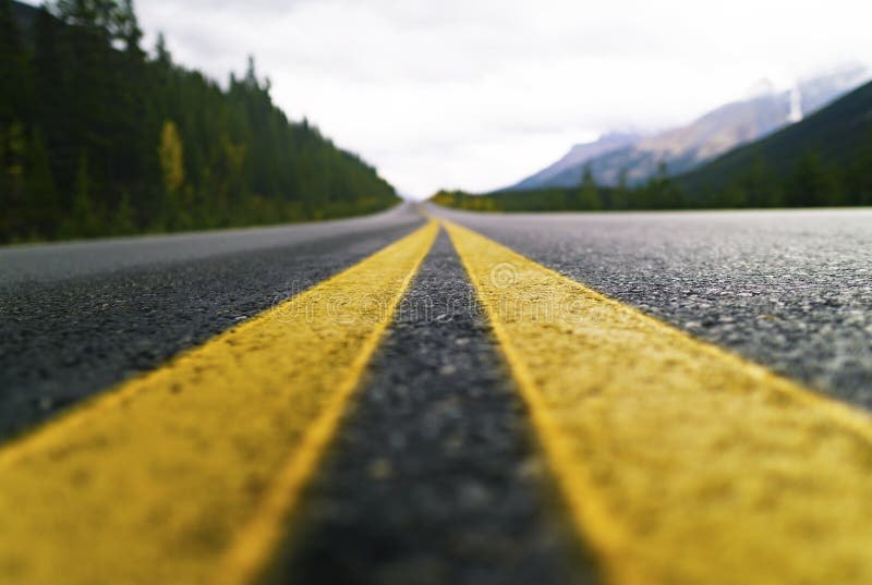 Dramatic Highway Close Up into Wild Remote Mountains Blurred Background ...