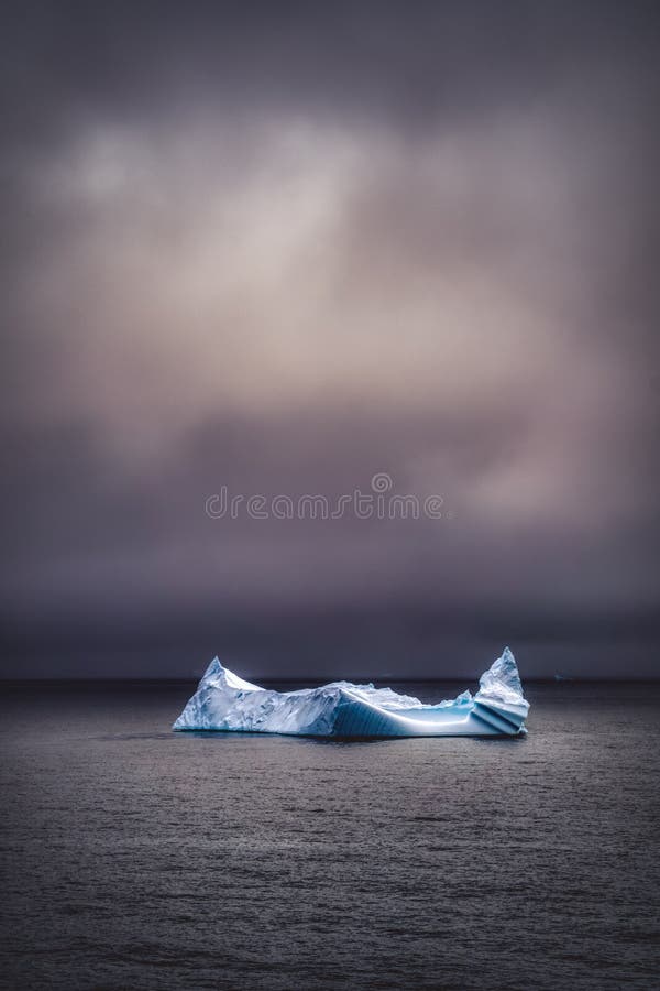Dramatic Image of an Iceberg Floating Stock Image - Image of cloudy ...