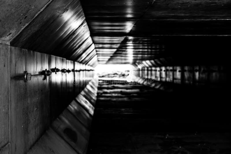 Dramatic Image Inside a Concrete Box Culvert Under a Road for ...