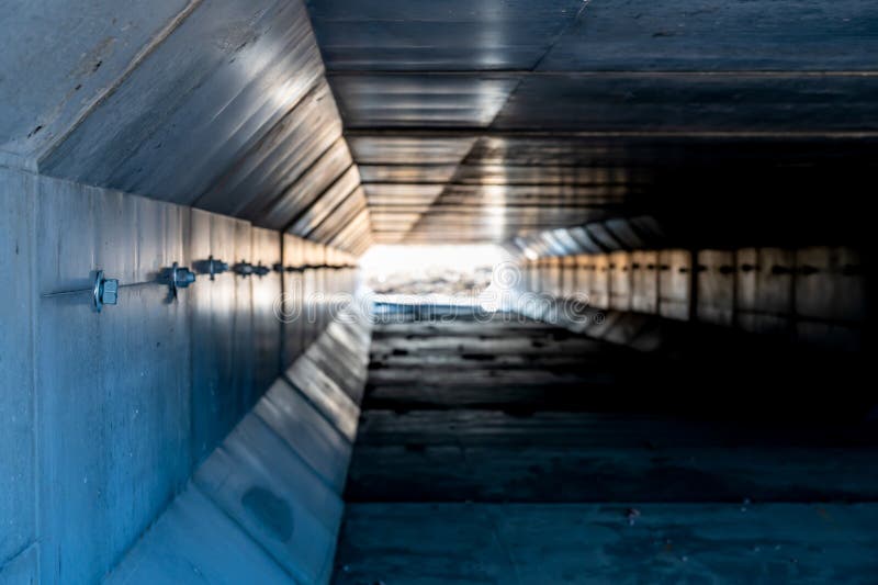 Dramatic Image Inside a Concrete Box Culvert Under a Road for ...
