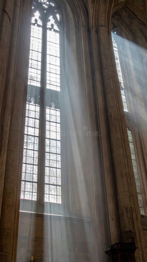Dramatic Light Beams through Arched Church Windows Creating Spiritual ...