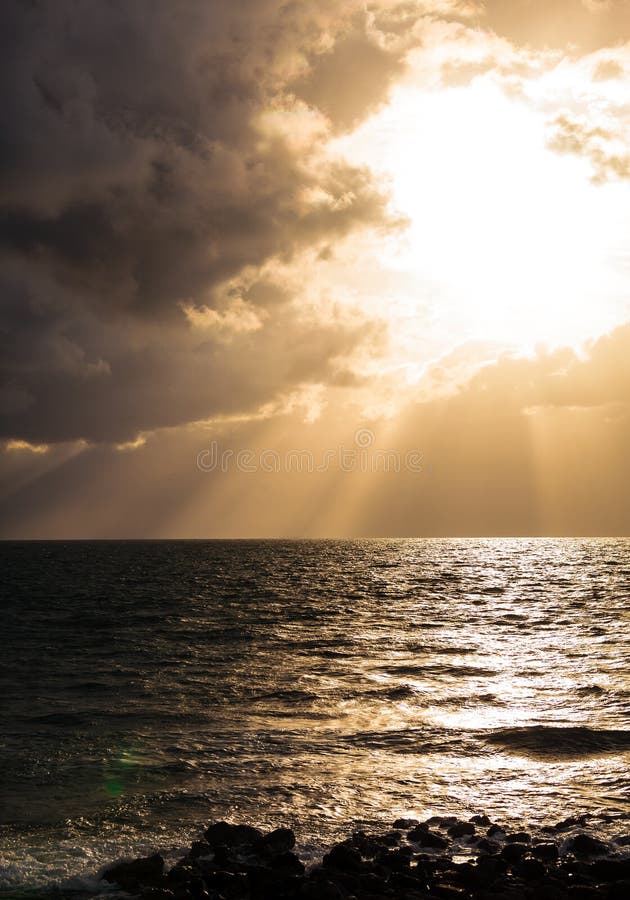 Dramatic Light with Sun Rays and Heavy Clouds Stock Photo - Image of ...