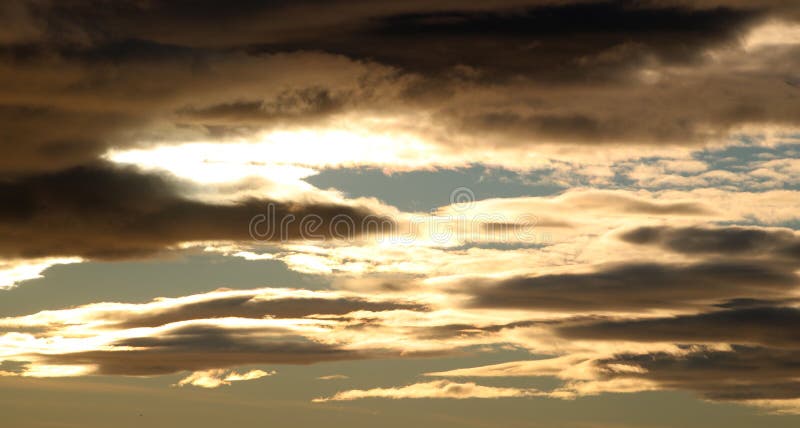 Dramatic Lighting on Clouds Near Sunset Background Stock Image - Image ...