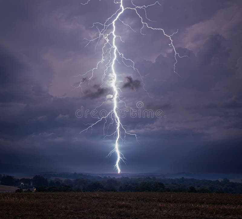 Dramatic Lightning Bolt Striking Down during a Thunderstorm Over a ...