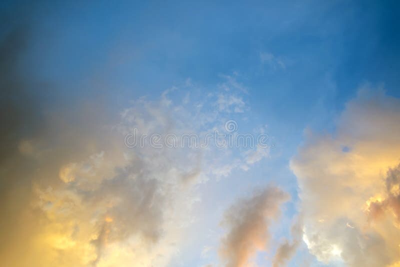 Dramatic Moody Sunset Landscape with Puffy Clouds Lit by Yellow Setting ...