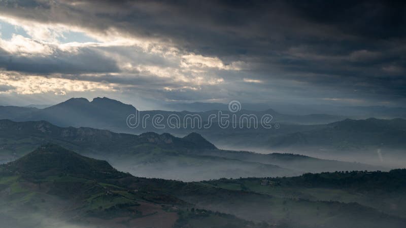 Dramatic Mountain Landscape with Mist and Clouds Stock Photo - Image of ...