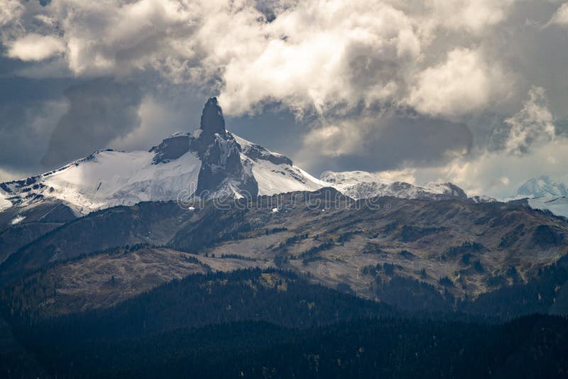 Dramatic Mountain Peak in Clouds Stock Image - Image of panoramic ...
