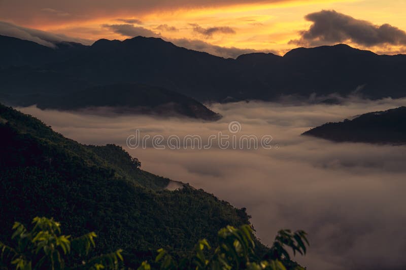 Dramatic Mountain Range Silhouetted Against Horizon Sea Clouds Stock ...