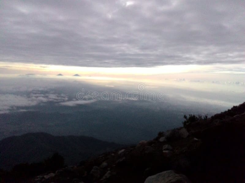 Dramatic Mountain View Under Cloudy Sky at Sunrise Stock Photo - Image ...