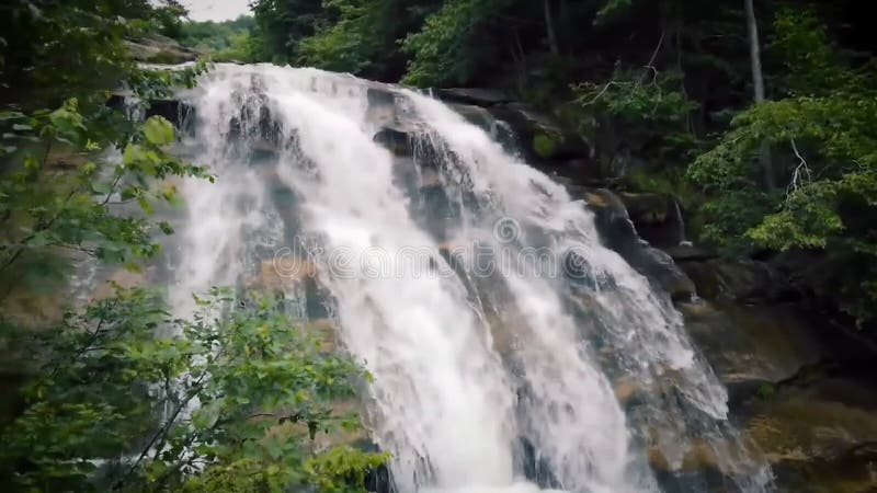 Dramatic Multi-tier Waterfall Cascading Down Cliff Face. Powerful ...