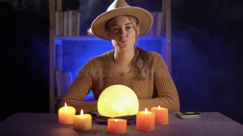 Dramatic of a Mystic Young Fortune Teller with a Lighted Crystal Ball ...