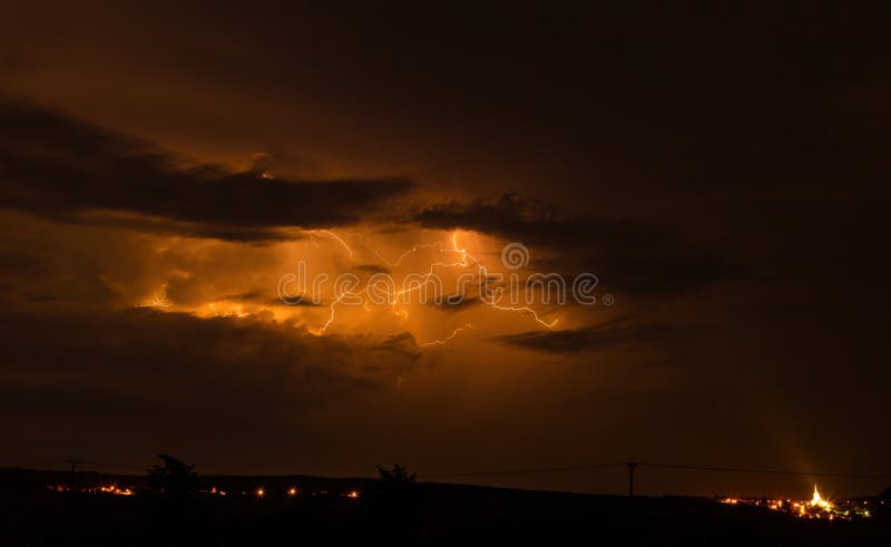 Dramatic Night Sky with Lightning Over Distant Town. Stock Image ...