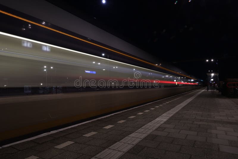 A Night Time Shot of a Train with Light Streaks on it S Tracks Stock ...