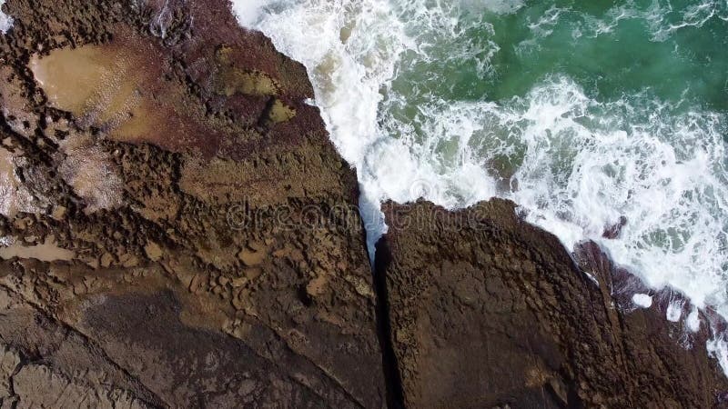 Dramatic Ocean Waves Breaking on Cliff Rocks Shot Top Down Drone Angle ...