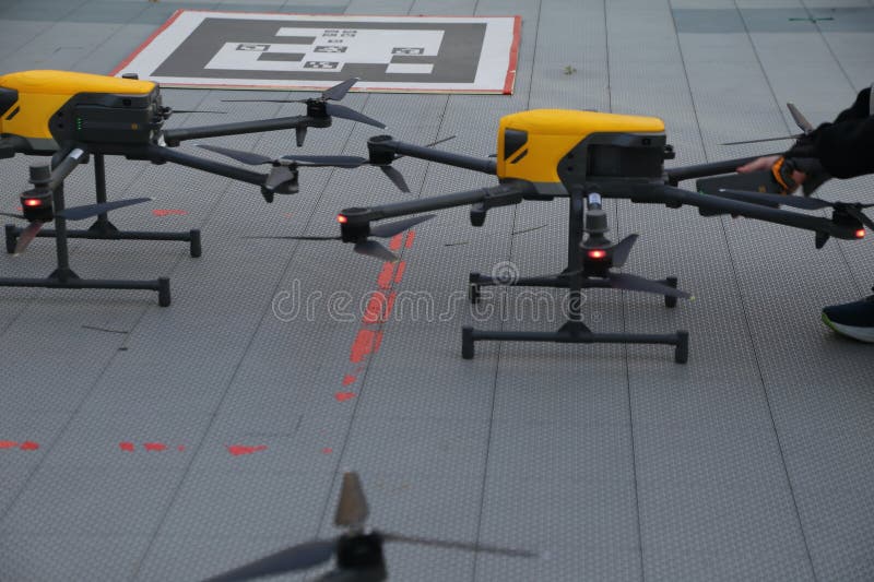 Dramatic Photo of Several Drones on the Ground, with Yellow and Black ...
