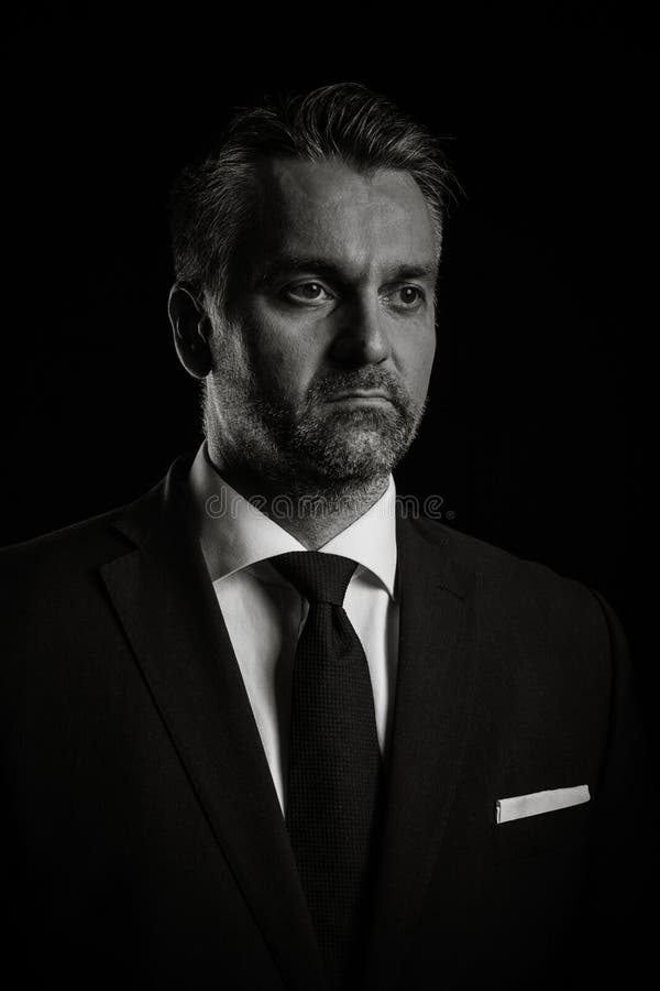 Dramatic Studio Light on Handsome Bearded Man with Sunglasses Over ...