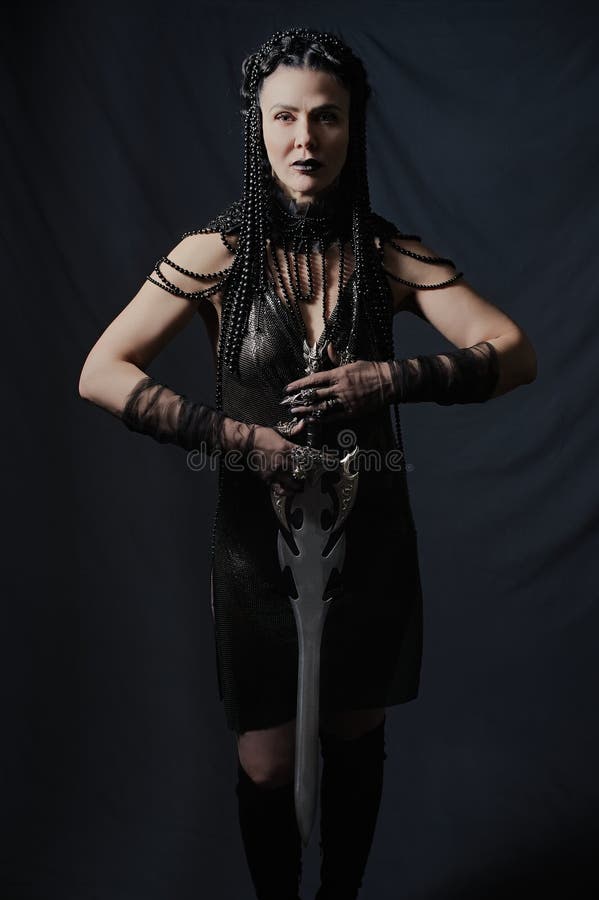 Dramatic Portrait of a Female Warrior with a Sword. Stock Image - Image ...