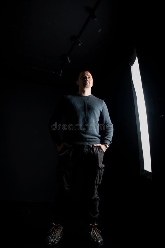 Dramatic Portrait of a Man in Dim Lighting Stock Image - Image of ...