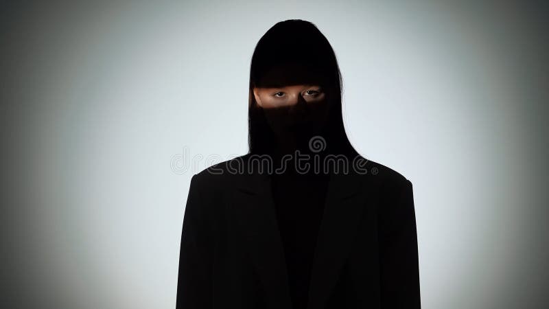 Dramatic Portrait of Woman in Shadow and Light Beam Stock Image - Image ...