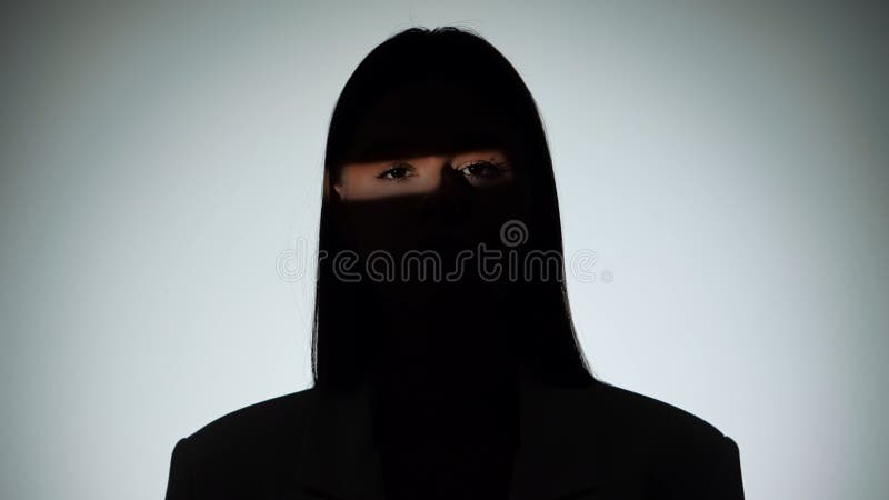 Dramatic Portrait of Woman in Shadow and Light Beam Stock Photo - Image ...