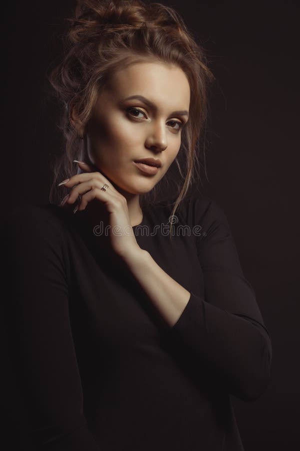 Dramatic Portrait of Young Brunette Model in the Shadows Stock Photo ...