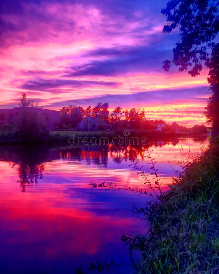 Dramatic Purple Sunset Over the River Stock Image - Image of colorful ...